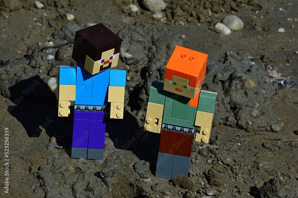 LEGO Minecraft figures of Alex and Steve characters are looking on ...