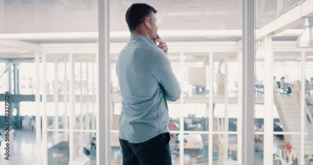 Thinking manager with vision looking through window, planning success ...