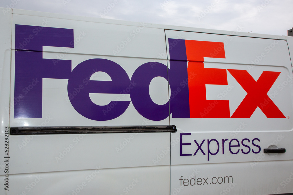 Fedex express logo brand and sign text on panel delivery van truck ...