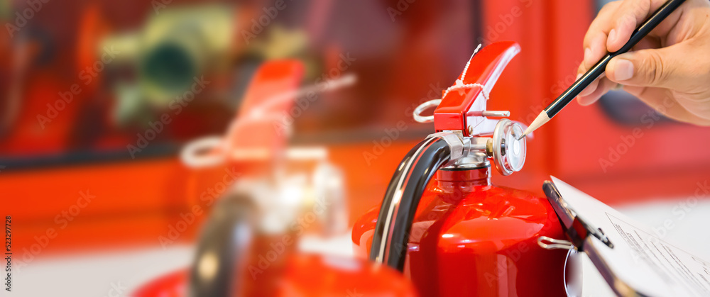 Fire extinguisher has hand engineer inspection checking pressure gauges ...