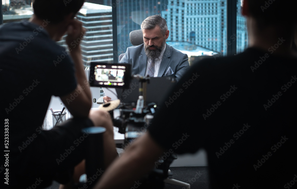 Behind the scenes - Film crew shooting a movie or a corporate video ...