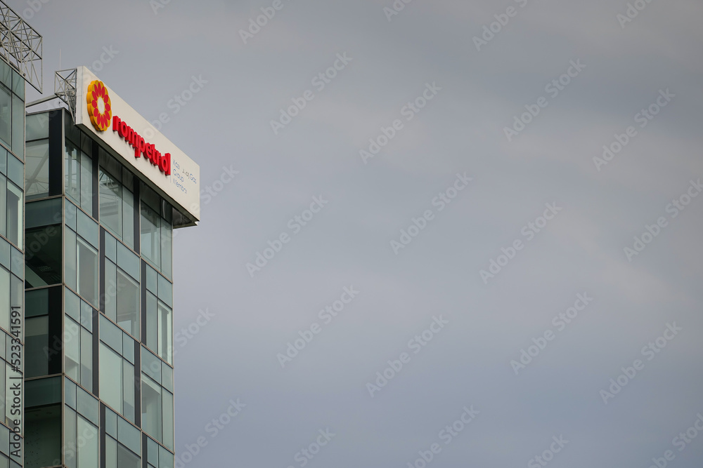 The logo sign of Rompetrol KazMunayGas energy gas and petrol company on ...