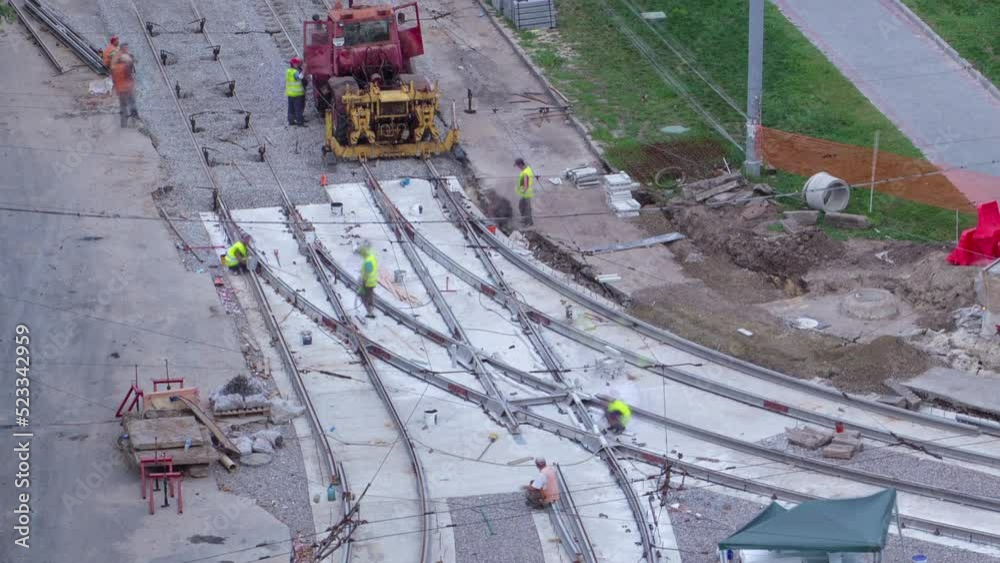 Vidéo Stock Repair works on the street timelapse. Laying of new tram ...