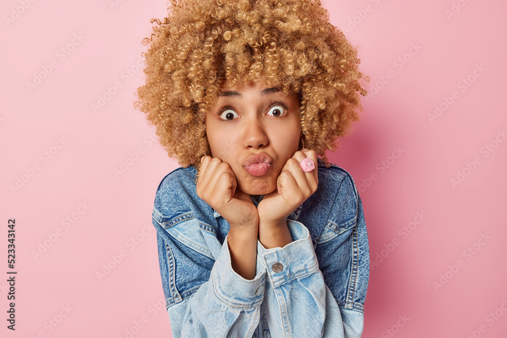 Human facial expressions concept. Curly haired young European woman ...