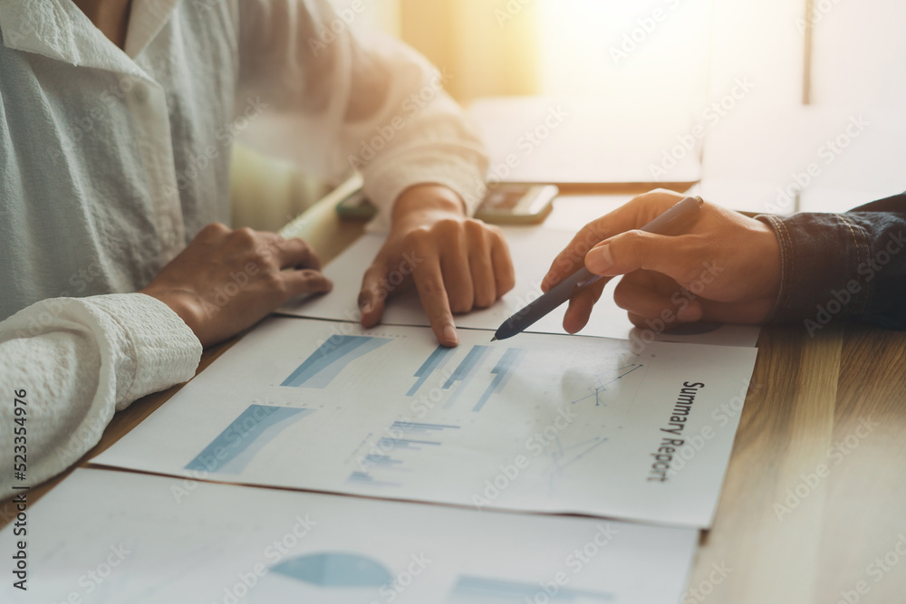 Professional businesswoman and man consulting, working on documents at ...