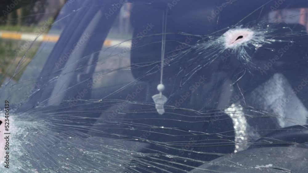 Stockvideo Holes on the windshield of the car, it was shot from a ...