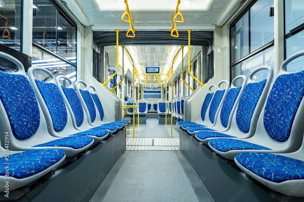 Large capacity bus. City passenger transport. Tram with blue seats ...
