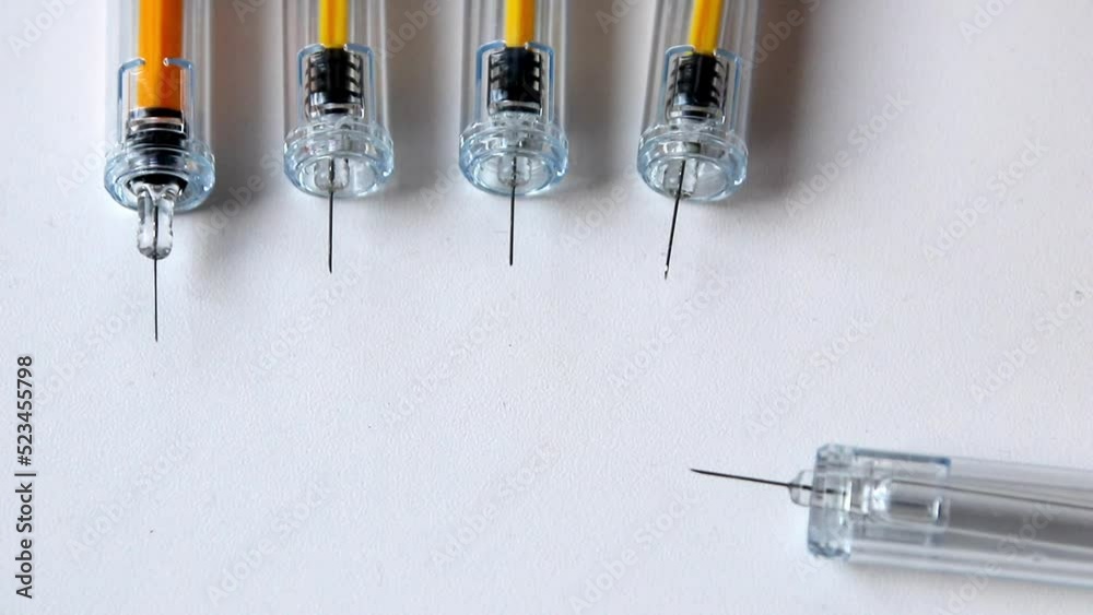 Multiple injection syringes show vaccinations doses and booster ...