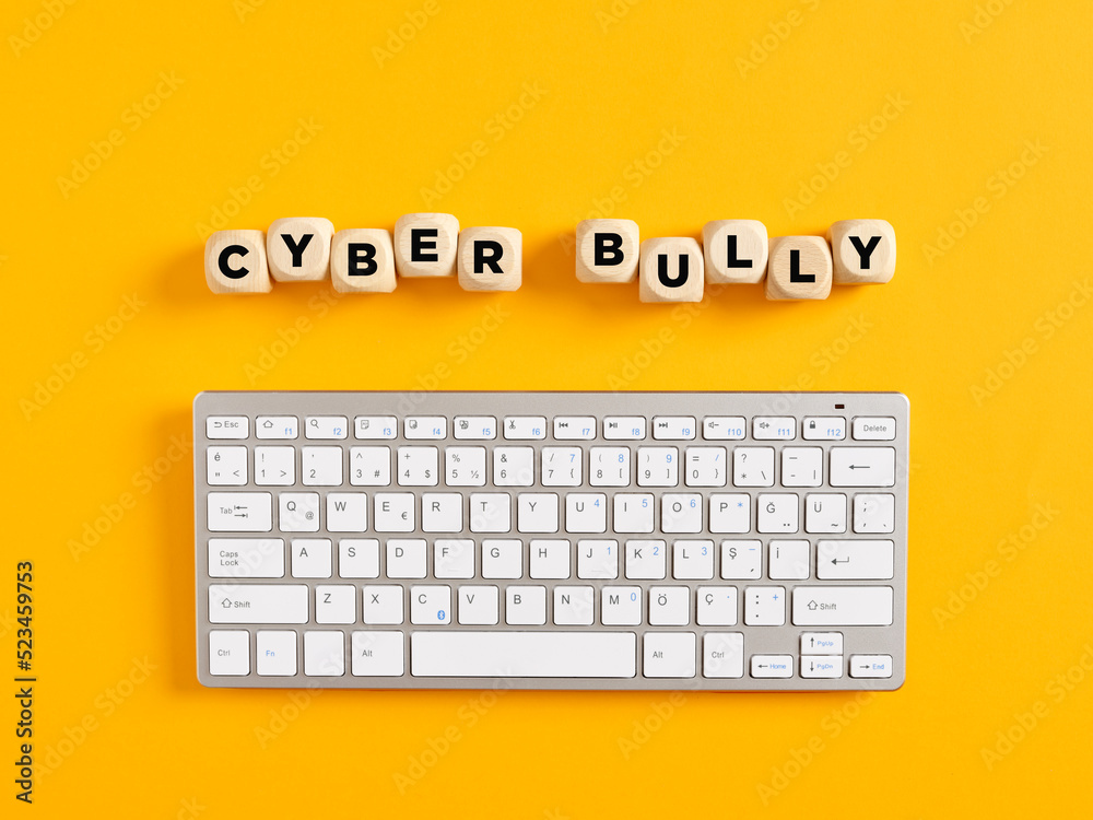 The word cyber bully with computer keyboard on yellow background. Cyber ...
