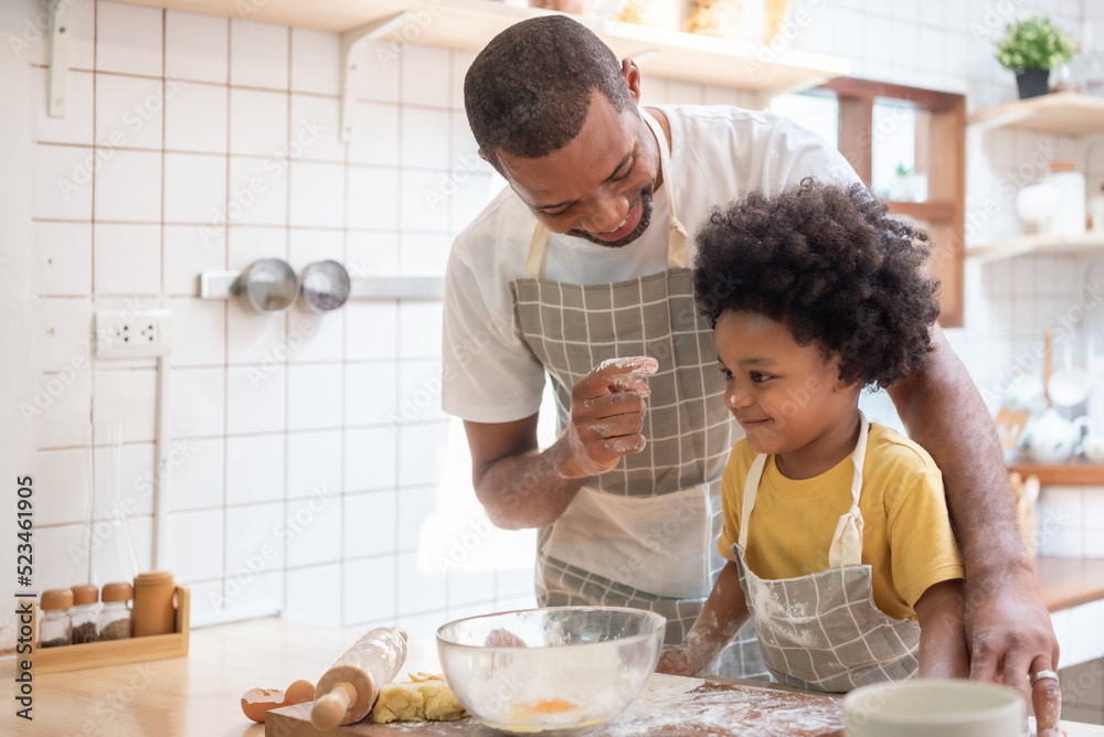 Black African American father enjoy playing with little son while ...