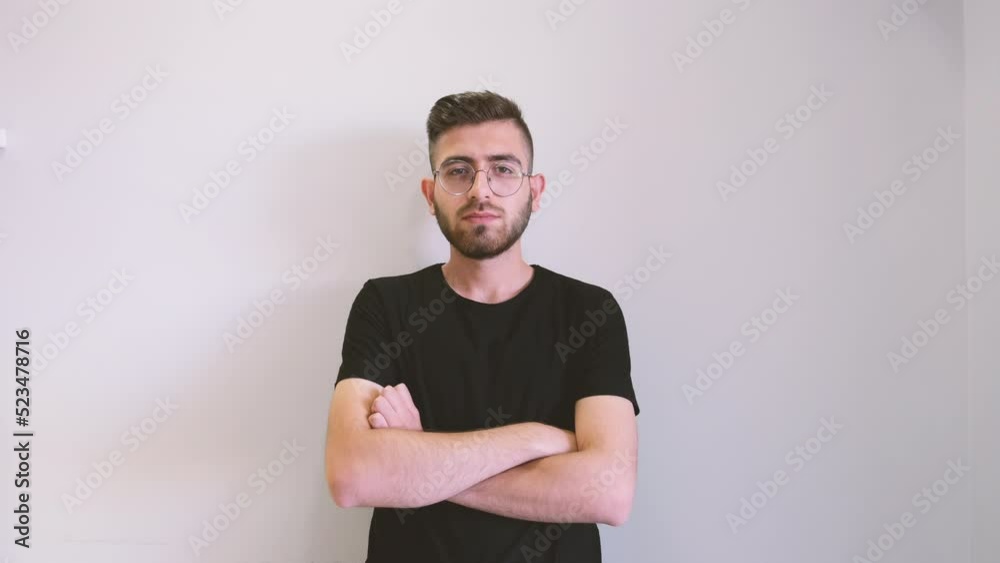 Arms crossed, portrait of young confident man arm crossed. Brown haired ...