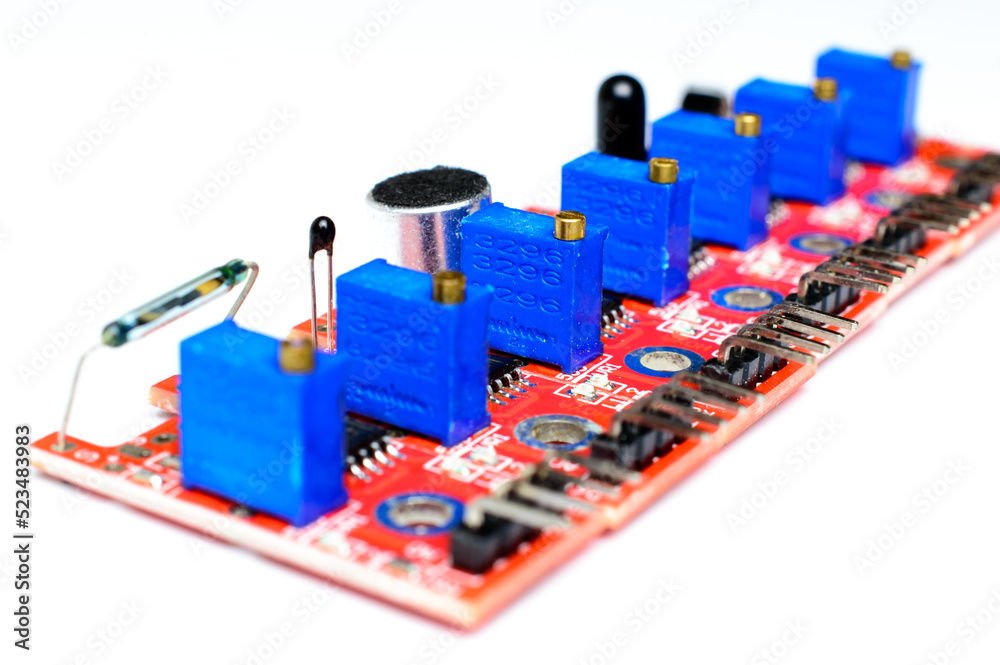 Arduino DIY modules on a white background. Selective focus. Red PCB ...