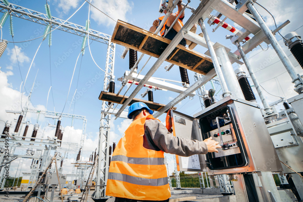 Adult electrical engineer inspect the electrical systems at the ...