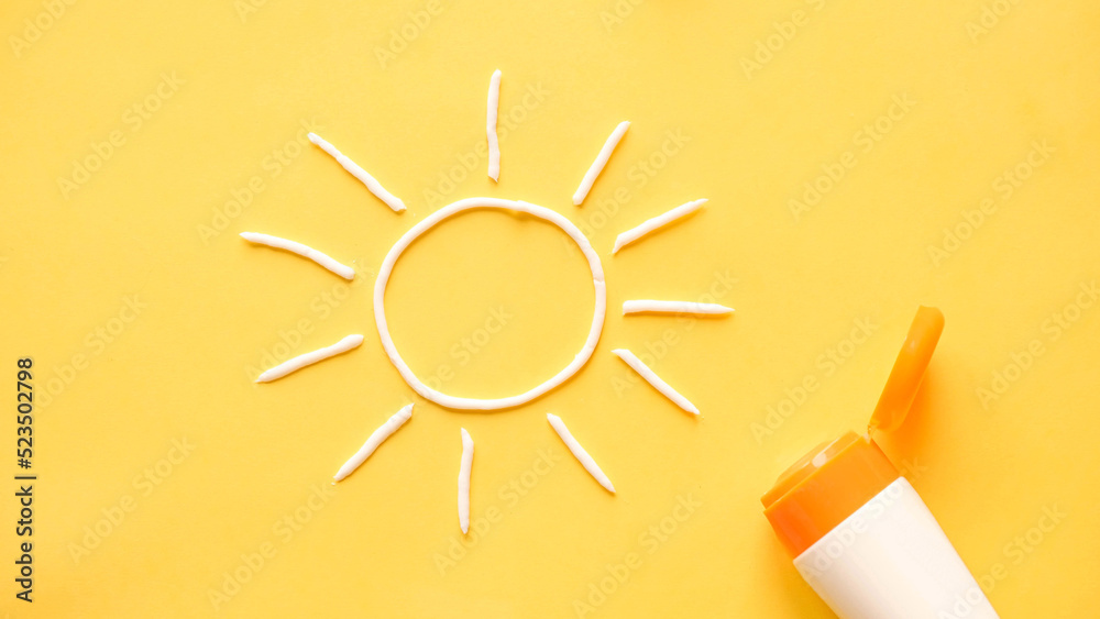 Sunscreen. Protect skin from sun. Sun symbol drawn with cream and ...