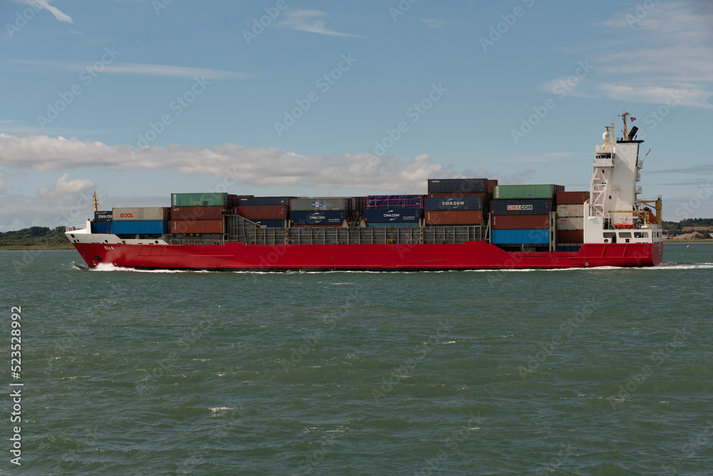 Southampton Water, southern England, UK. 2022. A small container ship ...