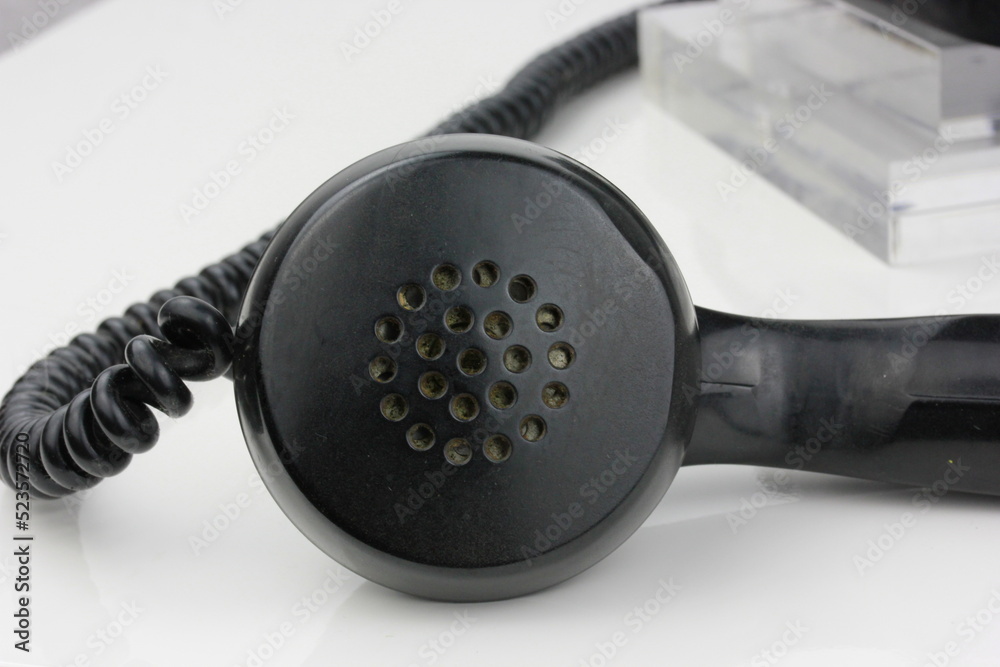 old antique dial operated telephone black out of bakelite on white ...