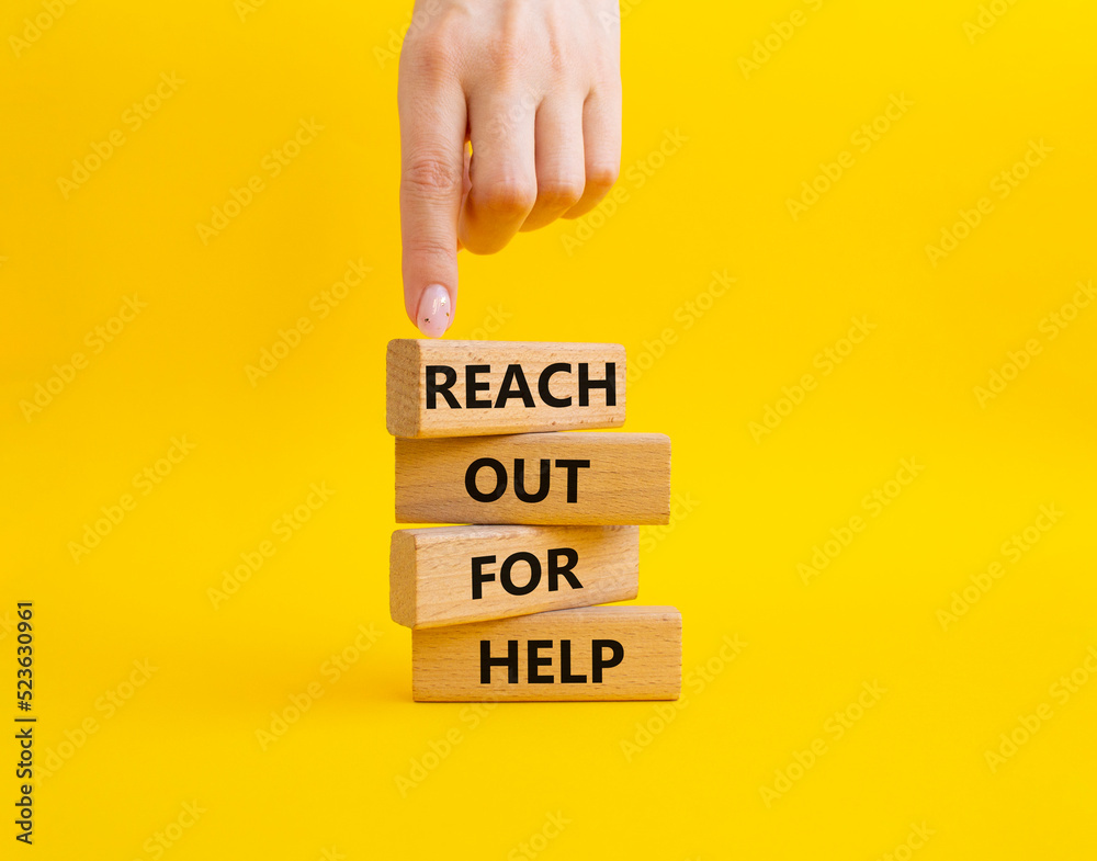 Reach out for help symbol. Wooden blocks with words Reach out for help ...