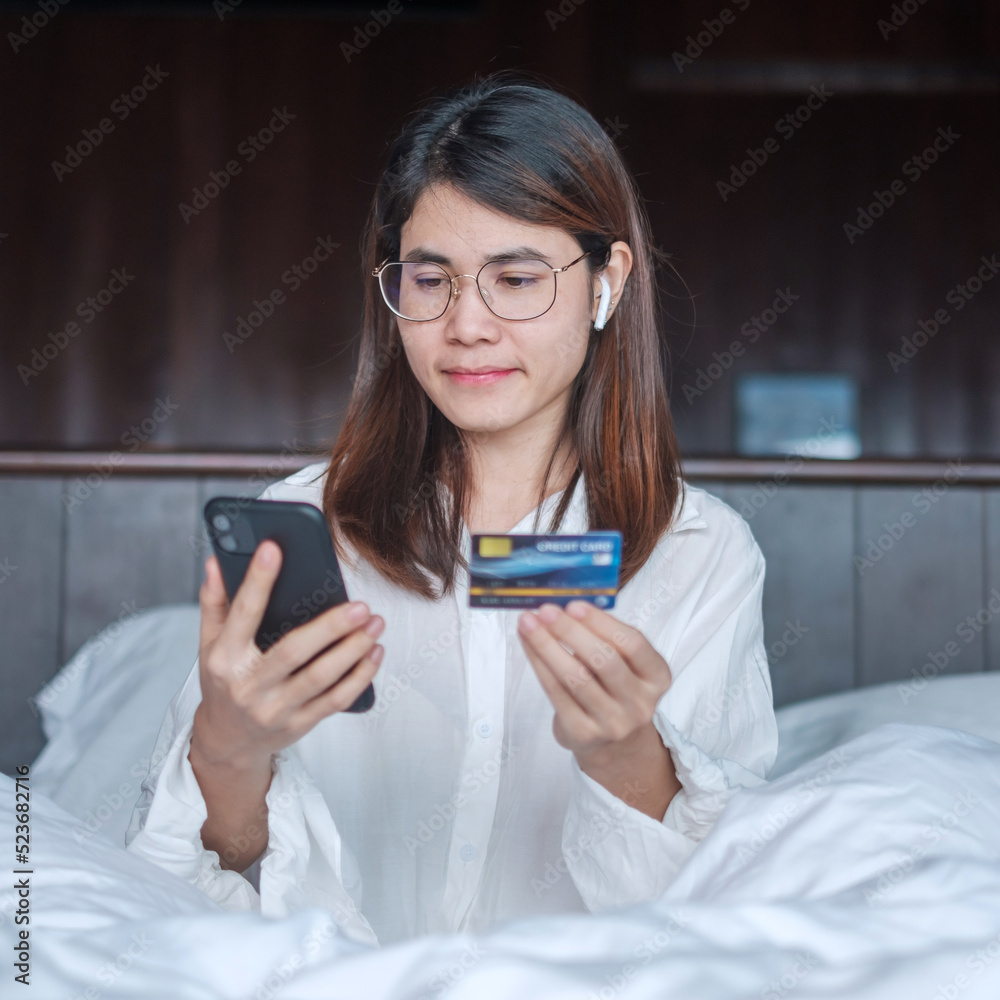 woman using mobile smart phone and credit card for online shopping ...