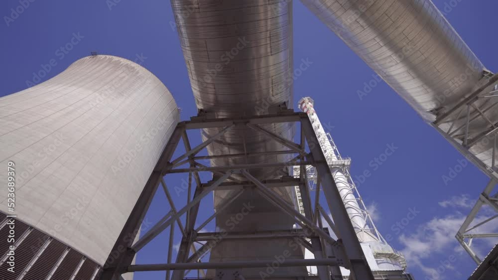 Cooling tower and factory chimneys. Chimneys and cooling tower in the ...