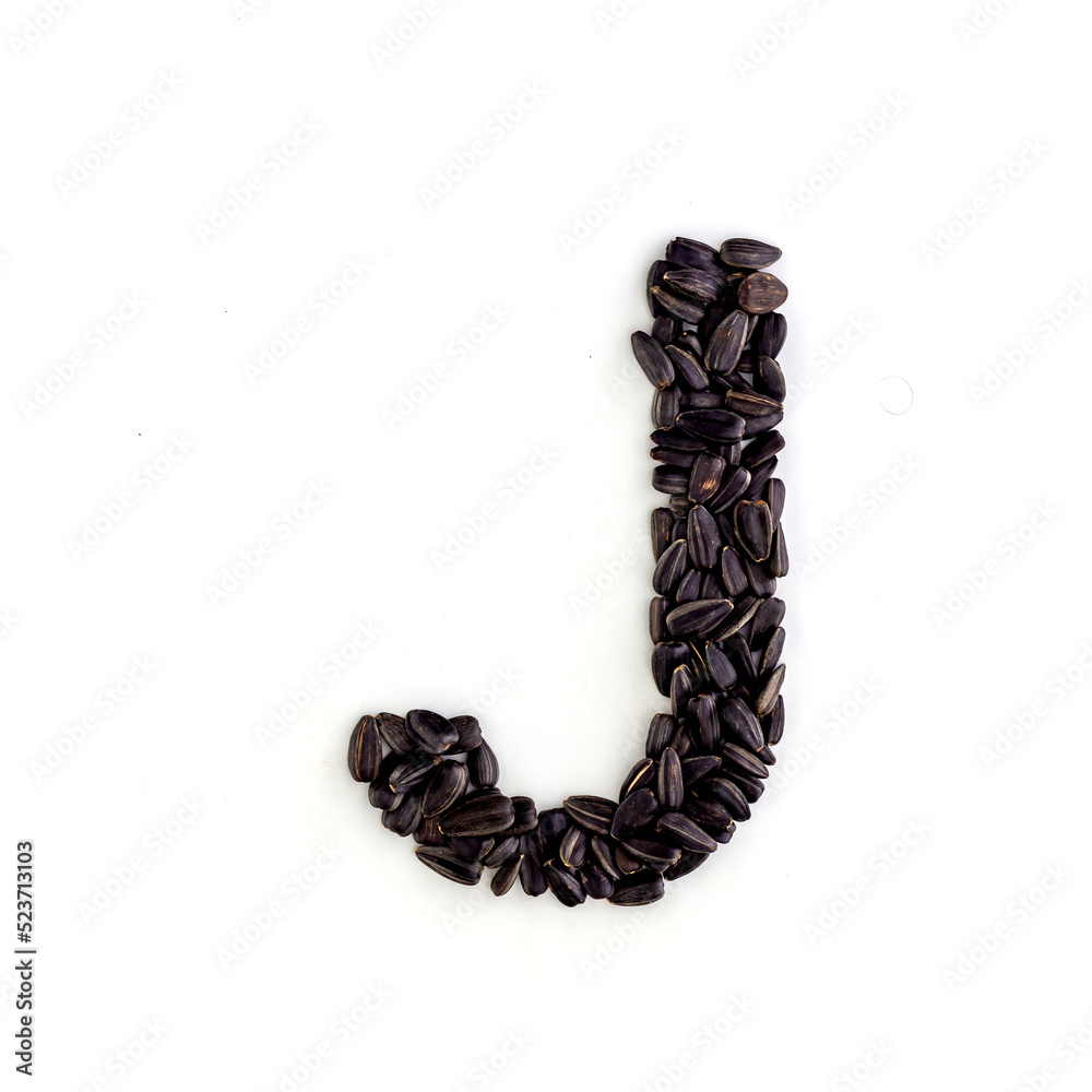 Capital letter J made from sunflower seeds. Alphabet made from ...