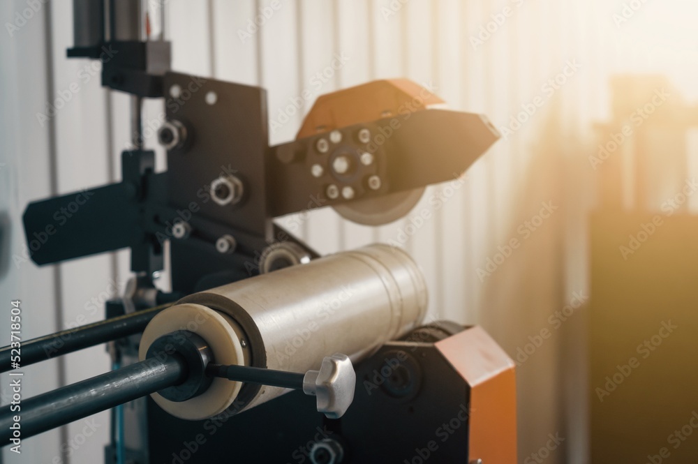 Modern machine for cutting cardboard cores. Special equipment of the ...