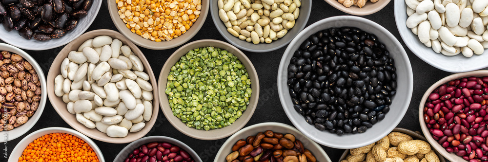 Banner of different types of legumes in bowls, green with yellow peas ...