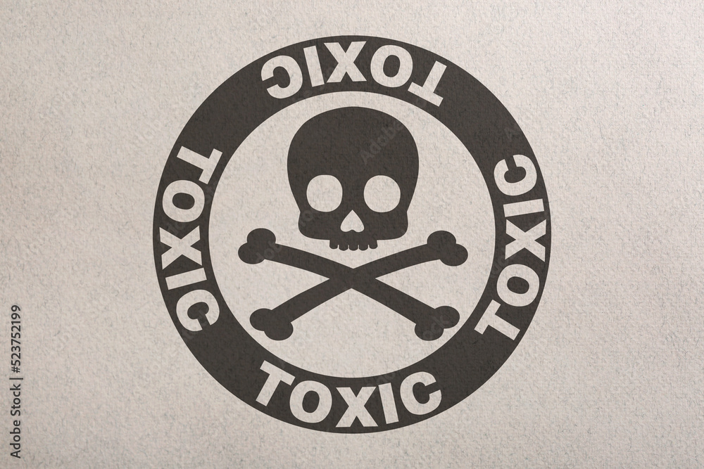 Hazard warning sign (skull-and-crossbones symbol and word TOXIC) on ...