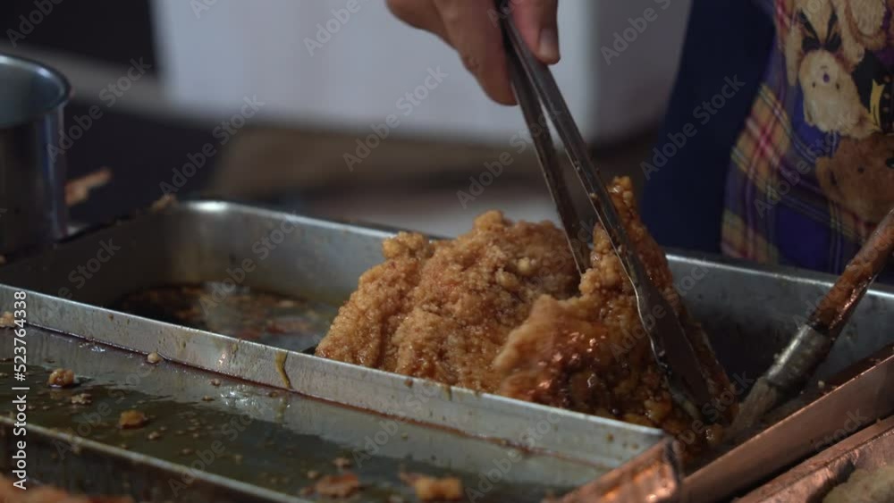 Tasty honey coated fried chicken cooking in progress, chef dipping ... Tasty honey coated fried chicken cooking in progress, chef dipping ...