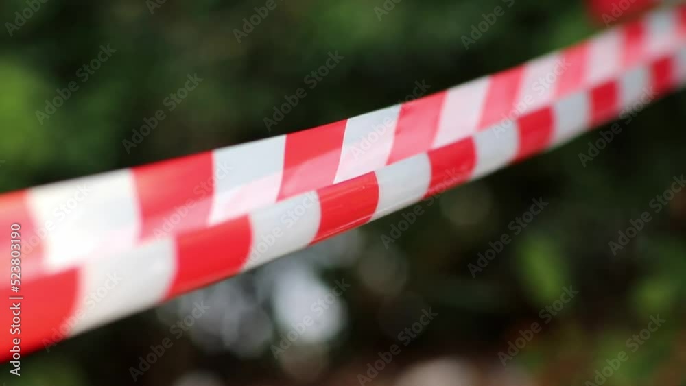 Red white barrier tape in pandemic lockdown marks crime scene ...