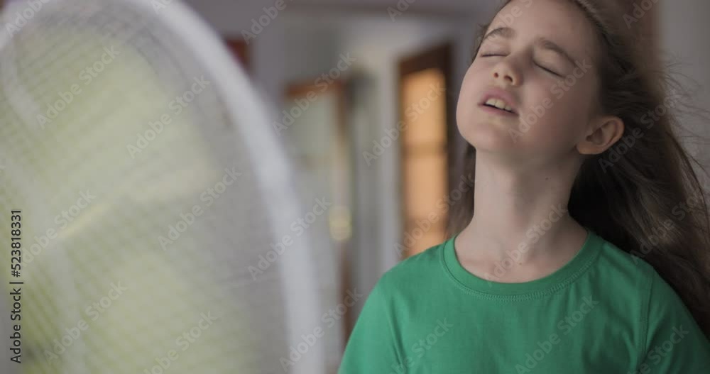Girl Standing in Front Fan Hot Day on Home in Living Room. Kid ...
