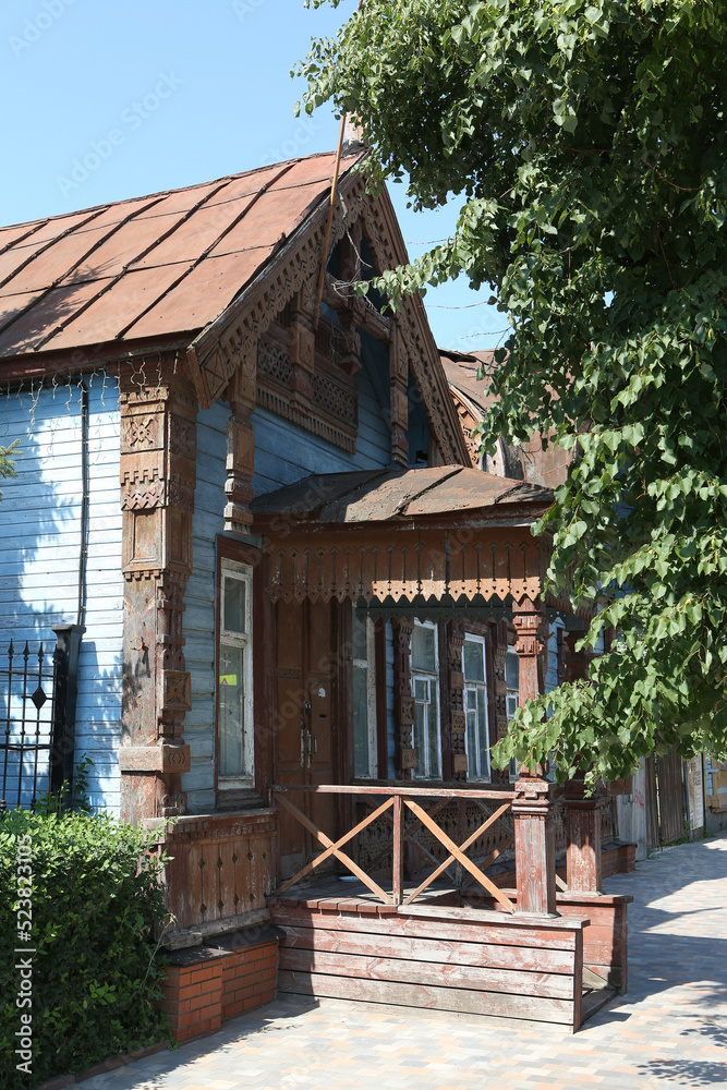 Vintage wooden rural house with ornamental windows, carved frames in ...