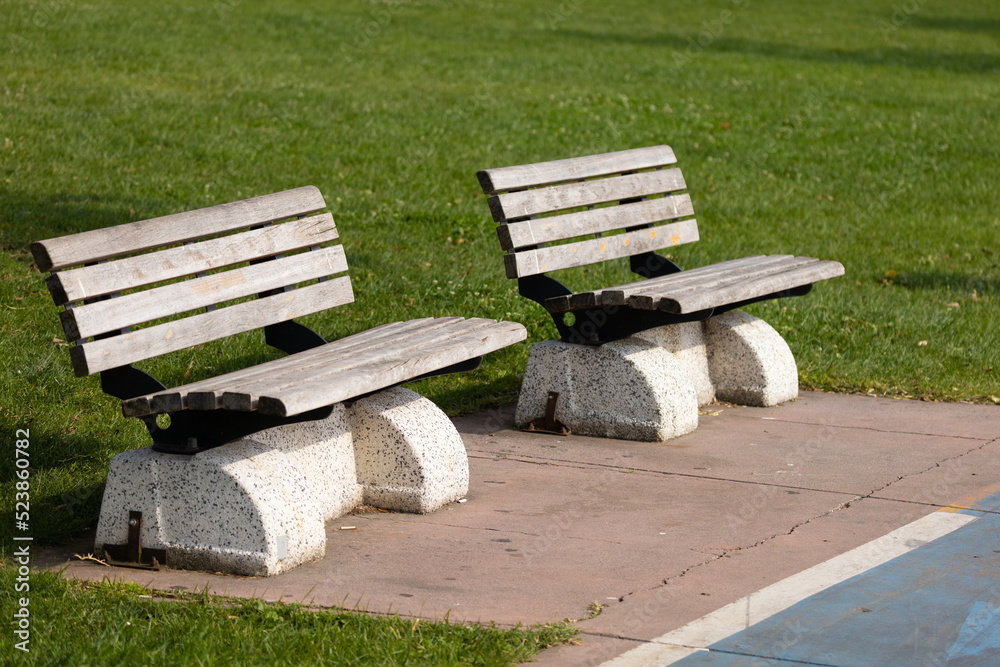 Wooden benches and chaise lounges for rest on the streets of the city ...