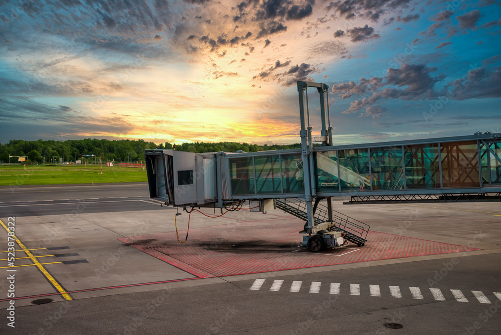 Jet bridge from an airport terminal gate. Stock Photo | Adobe Stock