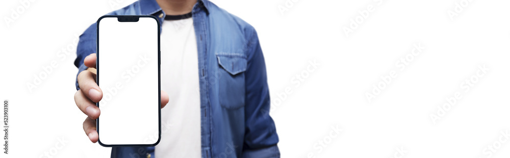 cell phone in hand in foreground and subject out of focus with ...