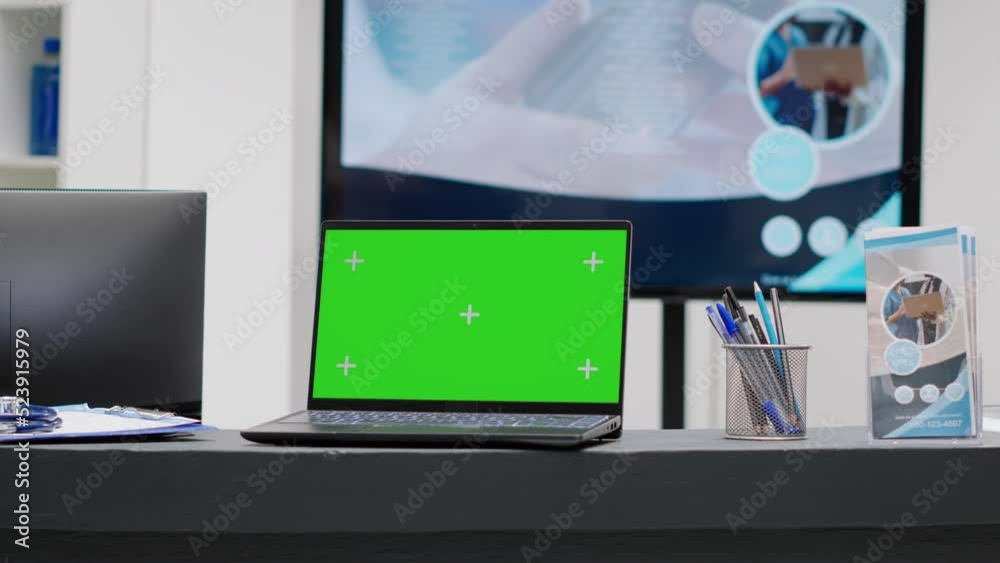 Greenscreen on laptop at hospital reception desk in medical waiting ...