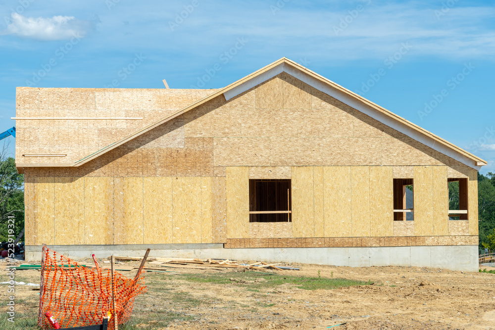 a residential duplex house construction project showing the plywood ...