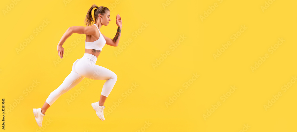 fitness woman runner running on yellow background. Woman jumping ...