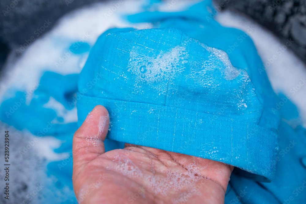 hand showing dirty stain on cloth from daily life activity for cleaning ...