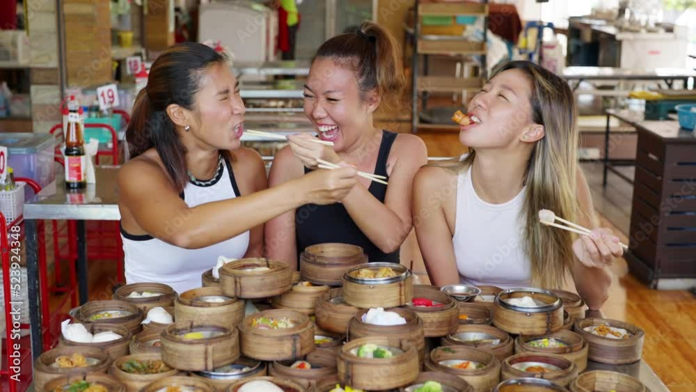 4K Group of Asian woman tourist eating Chinese food steamed dumpling ...