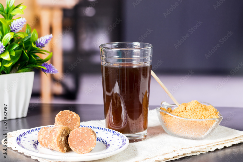 granulated panela and agua de panela or sugar cane sweets and lemon in ...