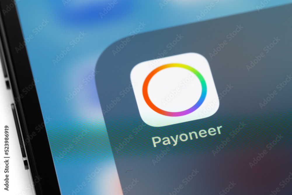 Payoneer logo mobile app on screen smartphone iPhone closeup. Payoneer ...