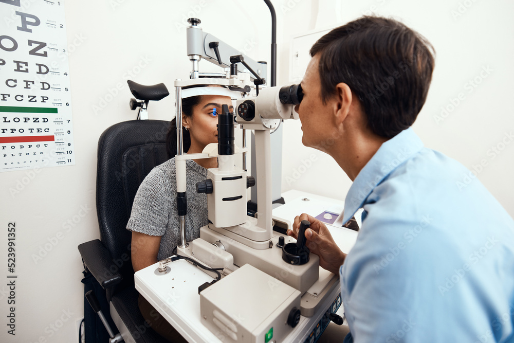 Eye and vision test, exam or screening with an optometrist, optician or ...