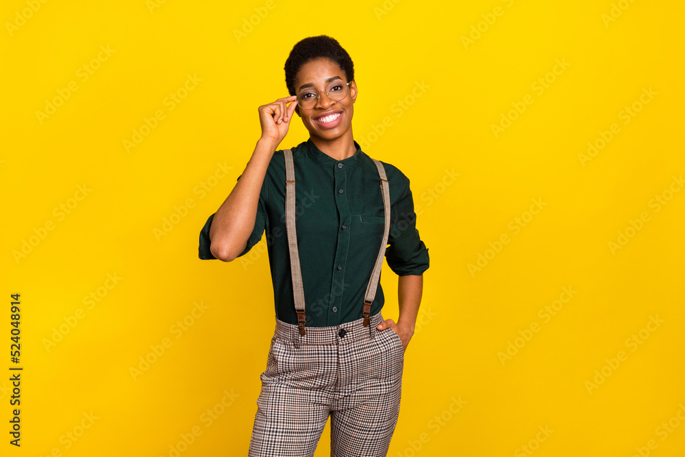 Portrait of attractive cheerful intellectual woman touching specs ...