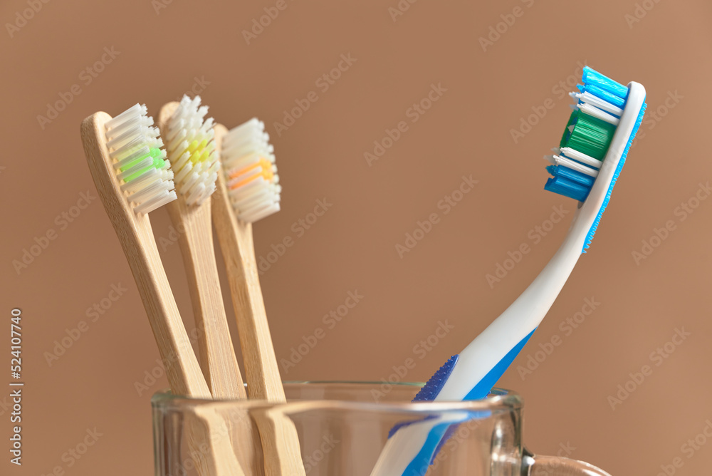 Toothbrushes, a plastic one and a set of three ecological made of ...