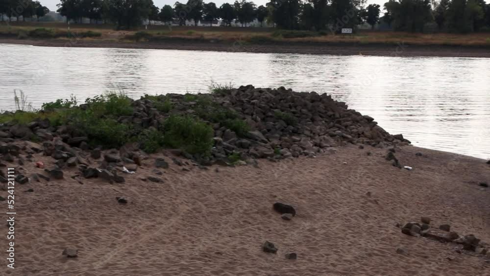 Extreme low water line in river Rhine Düsseldorf in extreme drought ...
