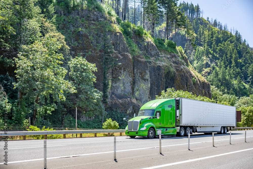 Bonnet bright green big rig semi truck with high roof cab transporting ...