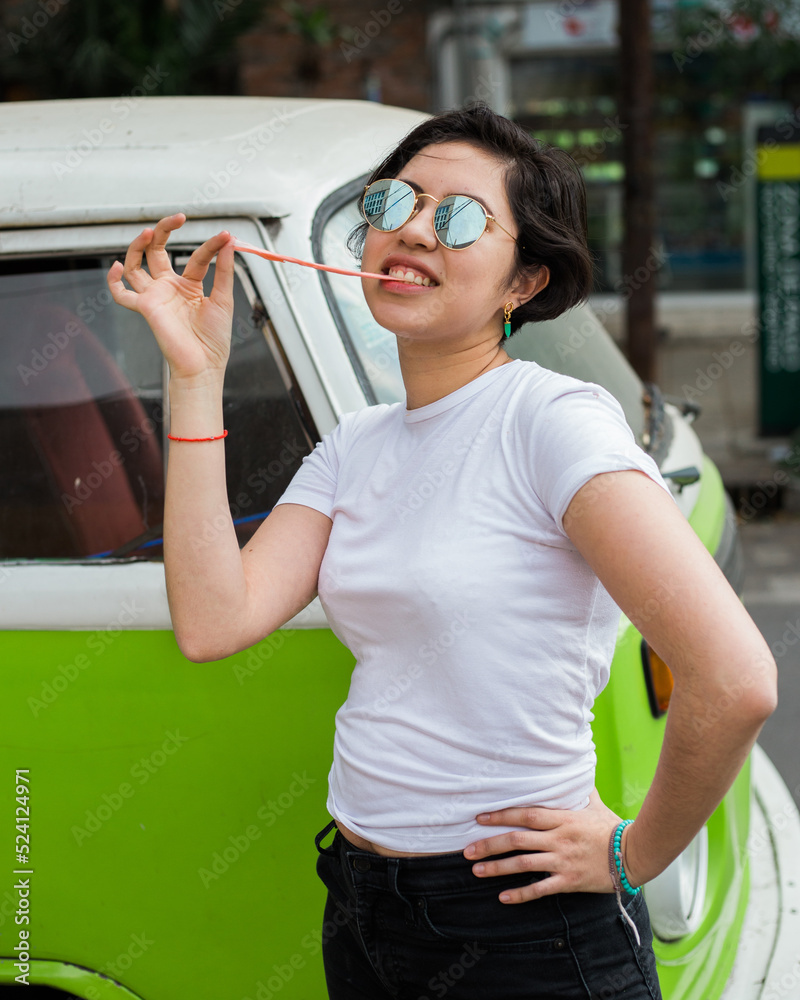 young greaser girl with short hair, posing with a fifties rockabilly ...