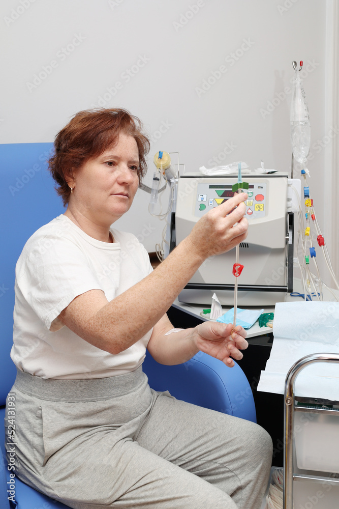 White middle age woman with kidney failure prepares for dialysis at ...