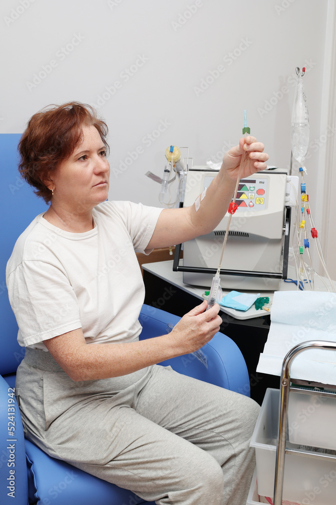 White middle age woman with kidney failure prepares for dialysis at ...