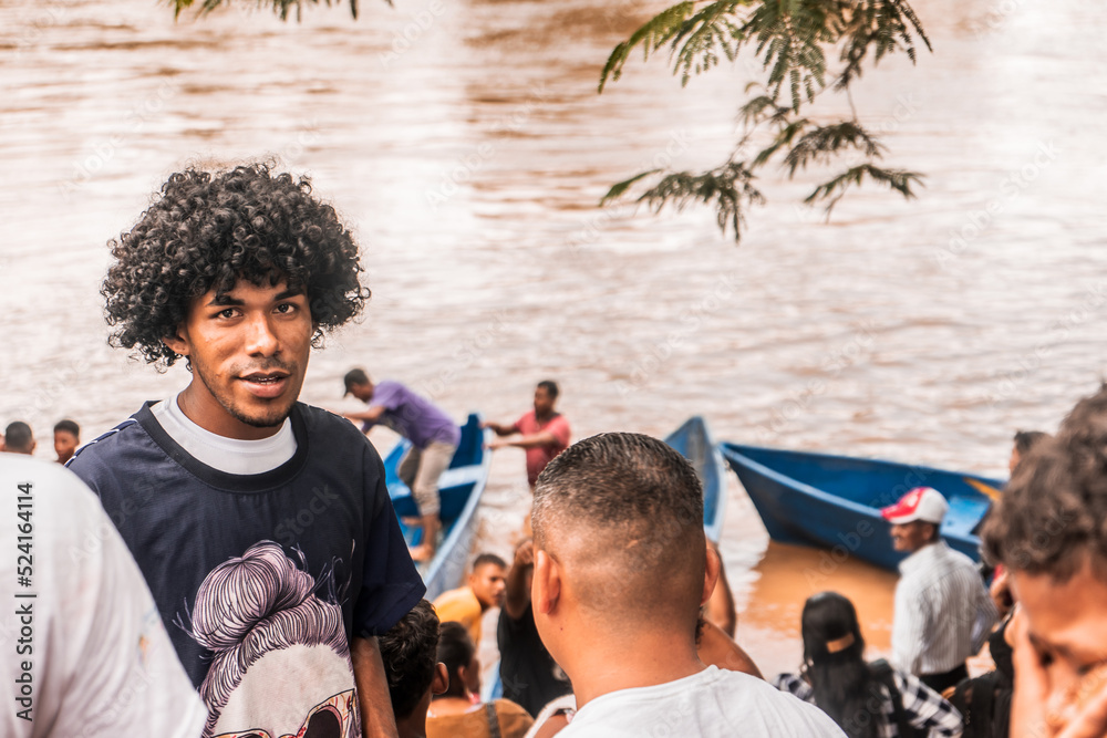 Indigenous man participating in a festivity in a river of an indigenous ...